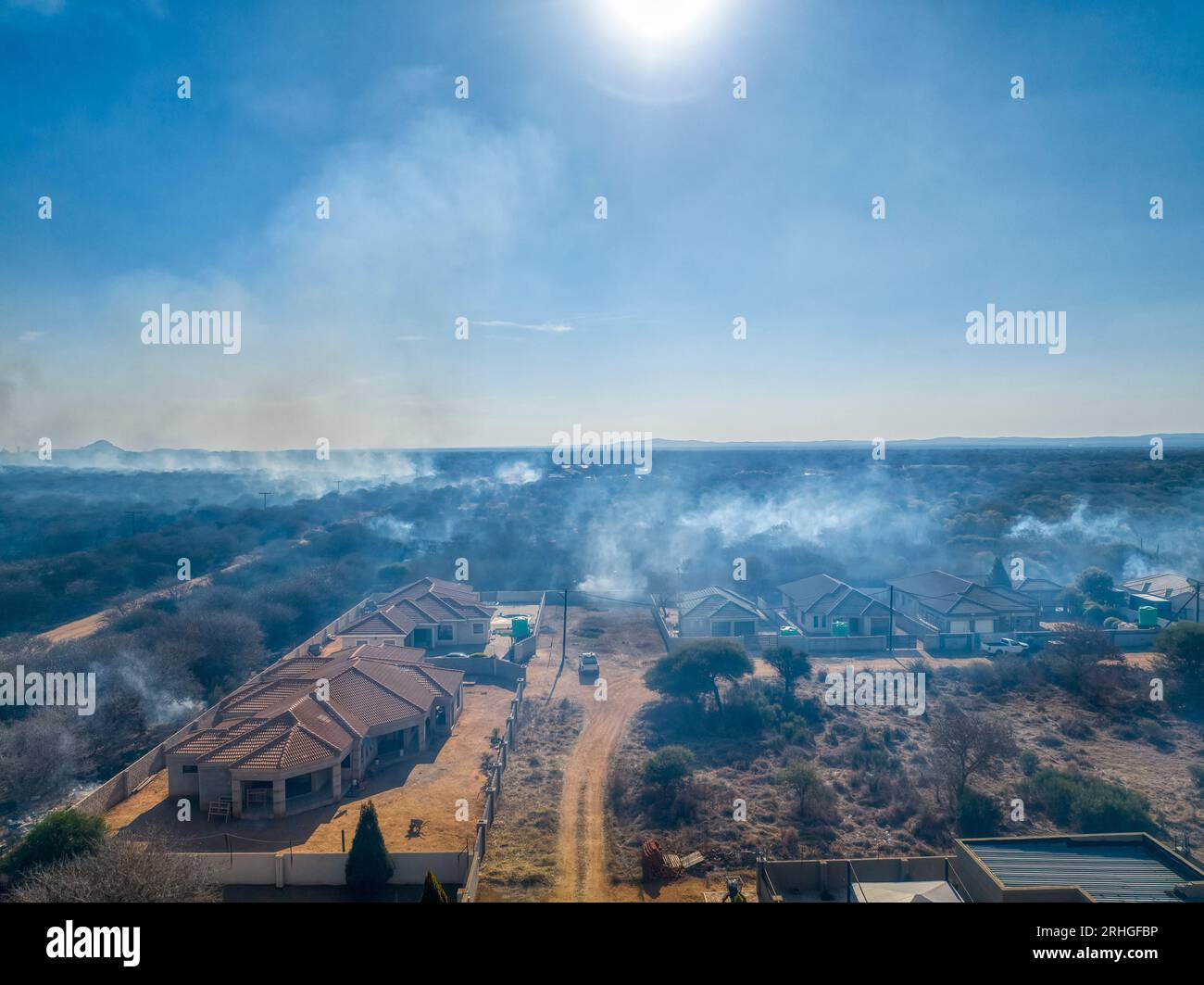 bush fire uncontrolled in Gaborone, Botswana, near the residential area ...