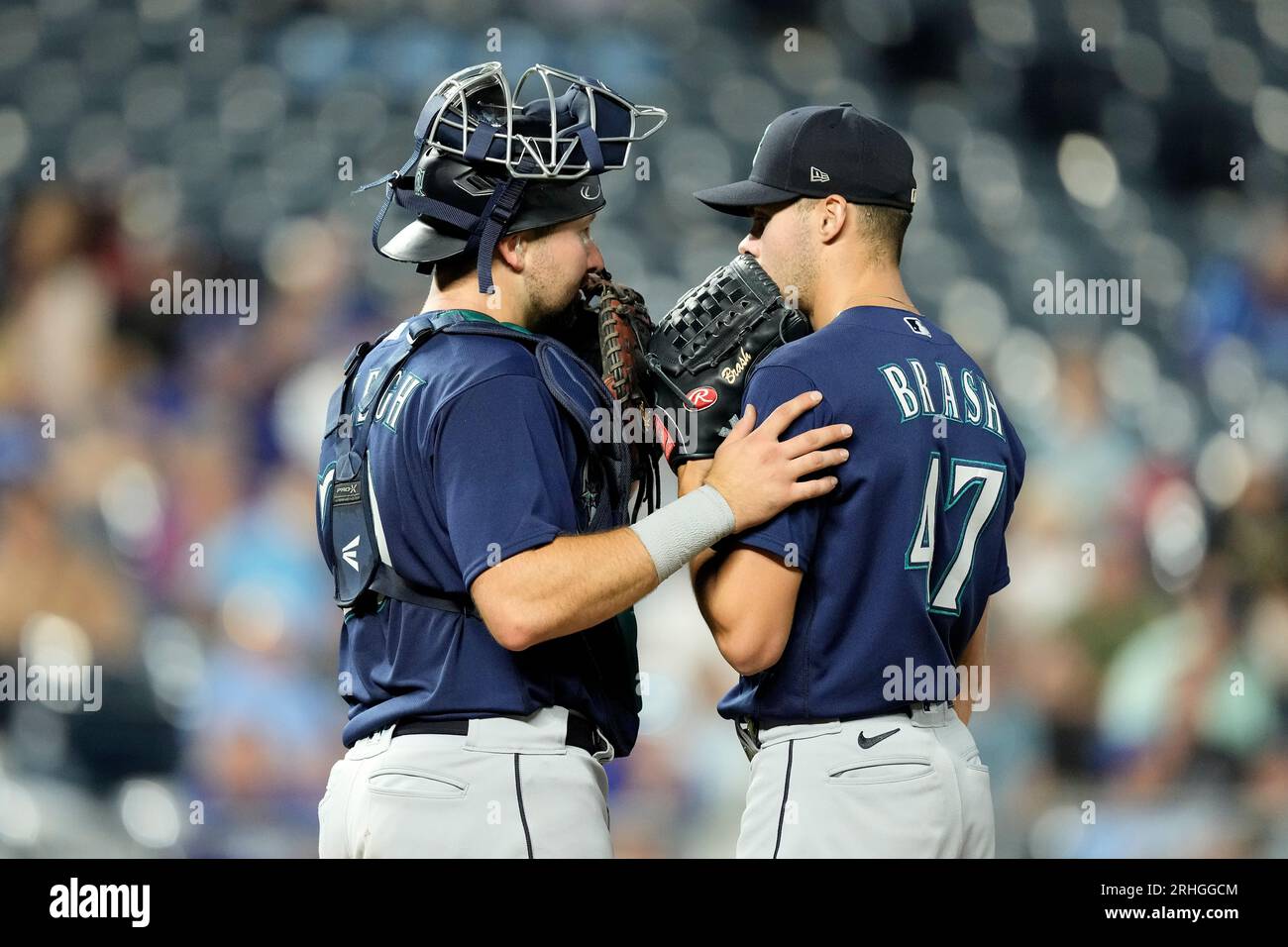 Seattle Mariners catcher Cal Raleigh, left, and relief pitcher Matt ...