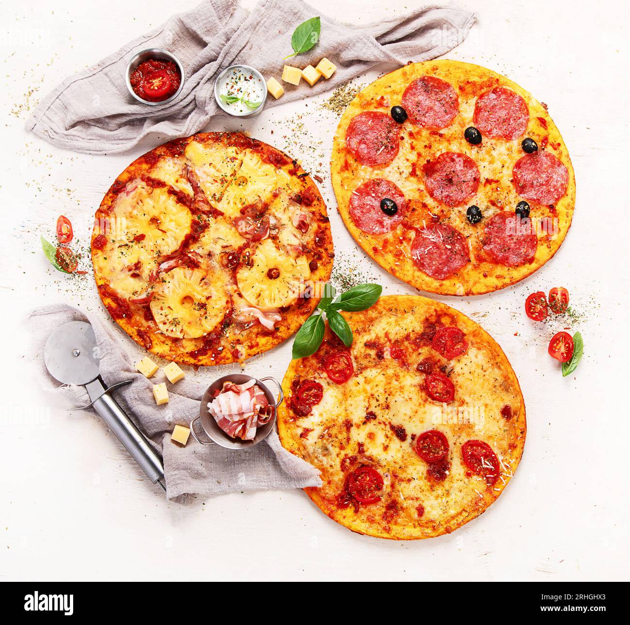 Different types of italian pizza on light background. top view Stock ...