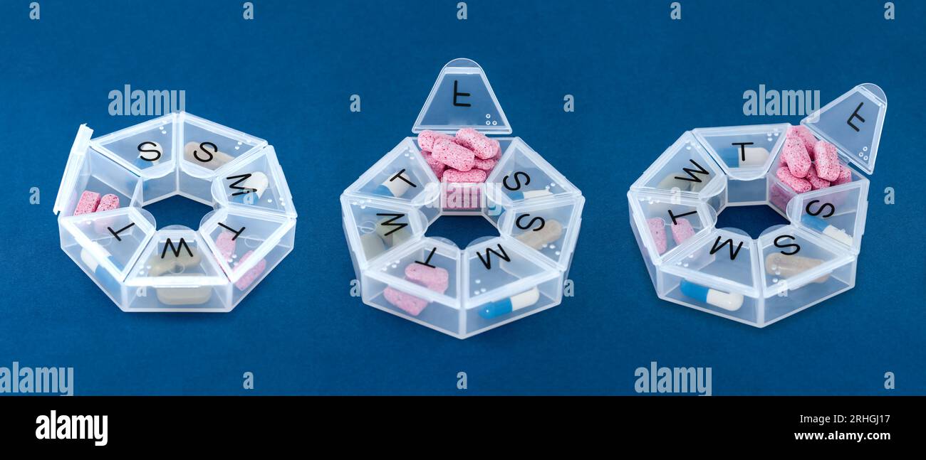 Set of weekly pill organizers. Three colorful containers for every day ...