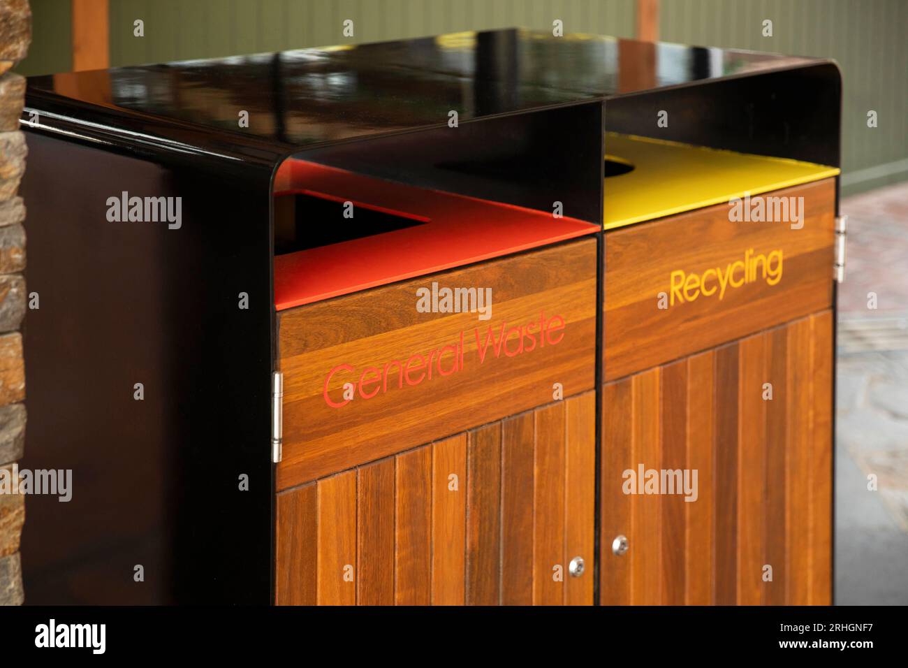 Modern waste and recycling bins, elegantly designed with a timber ...