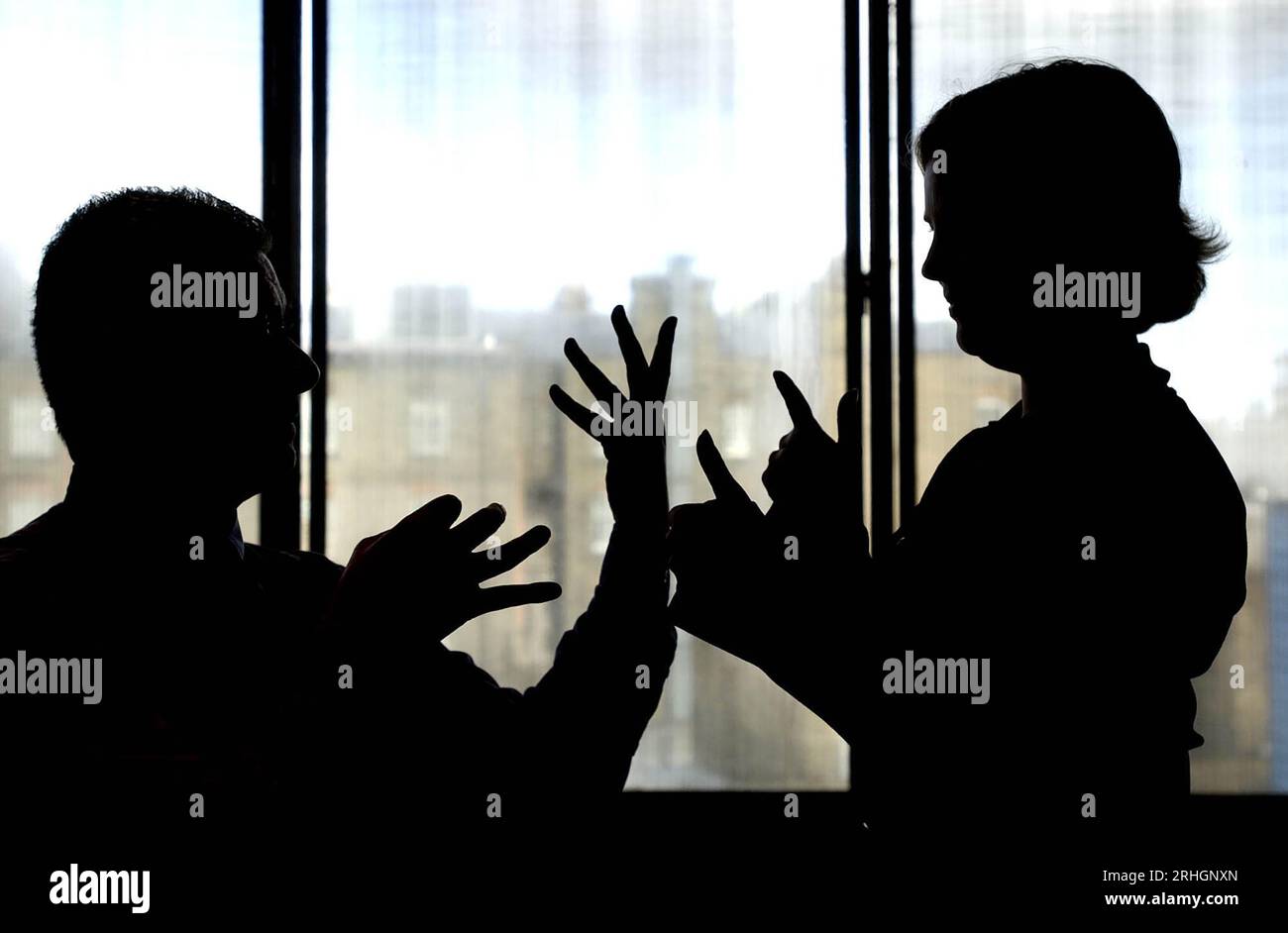 File photo dated 12/09/02 of people chatting via sign language, as ...