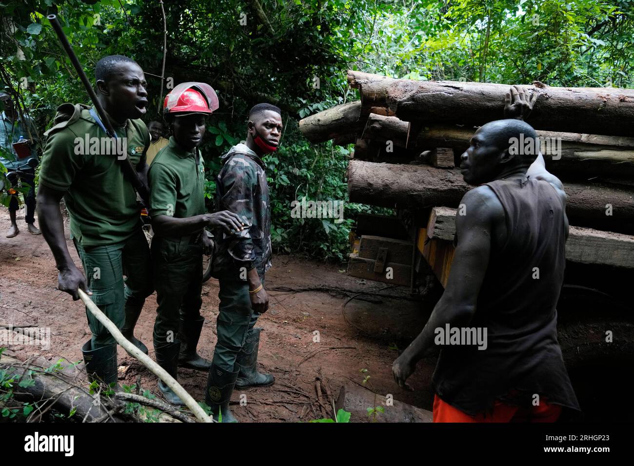 Sunday Abiodun, left, a former poacher turned forest ranger, argues ...