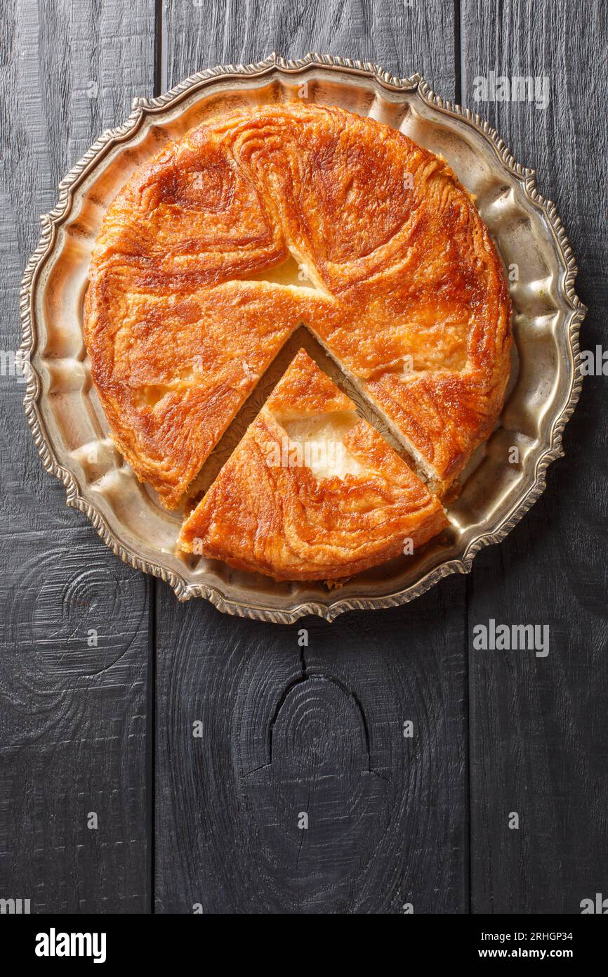 Kouign amann is a round multi-layered cake containing with laminated ...