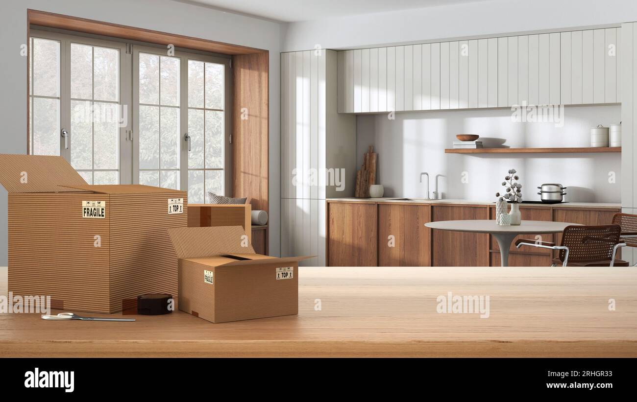 Wooden table, desk or shelf with stack of cardboard boxes over japandi ...