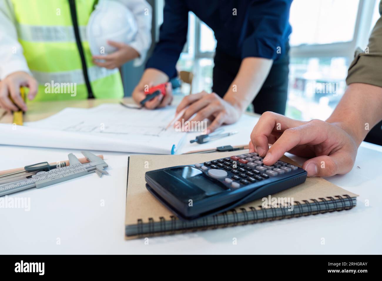 Architect client discussing plan blueprint hi-res stock photography and ...