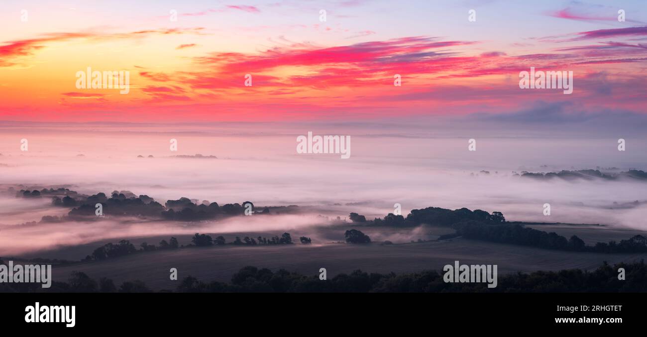 Misty morning sunrise from Bo Peep hill on the south downs east Sussex ...