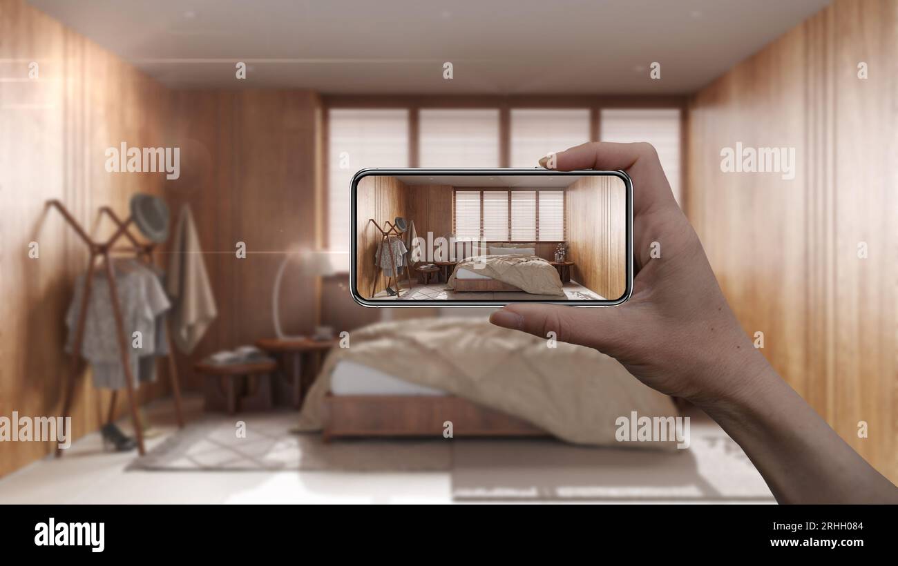 Hand holding smart phone, AR application, simulate furniture and ...