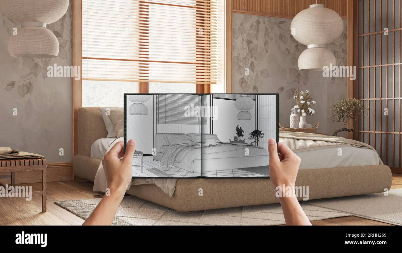 Hands holding notepad with japandi bedroom design blueprint sketch or drawing. Real interior ...