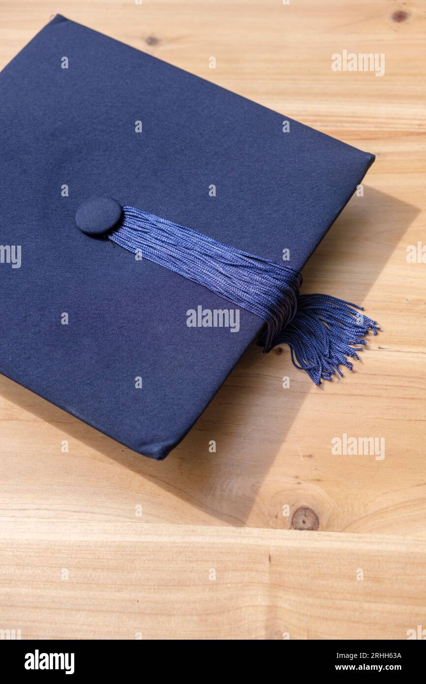 A traditional mortar board cap worn at University graduation ceremonies ...