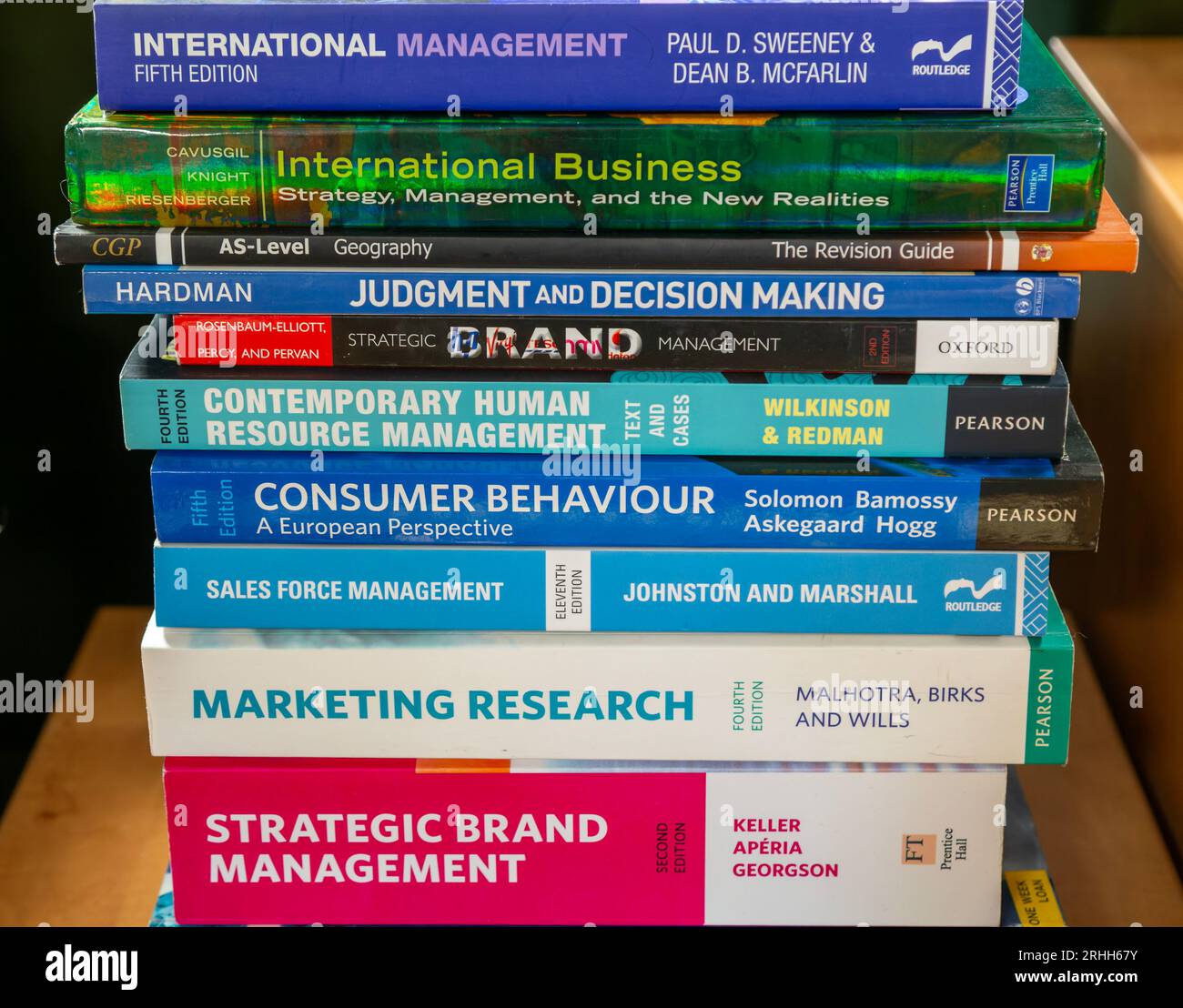 Side view of pile of management and business tax books, UK Stock Photo ...