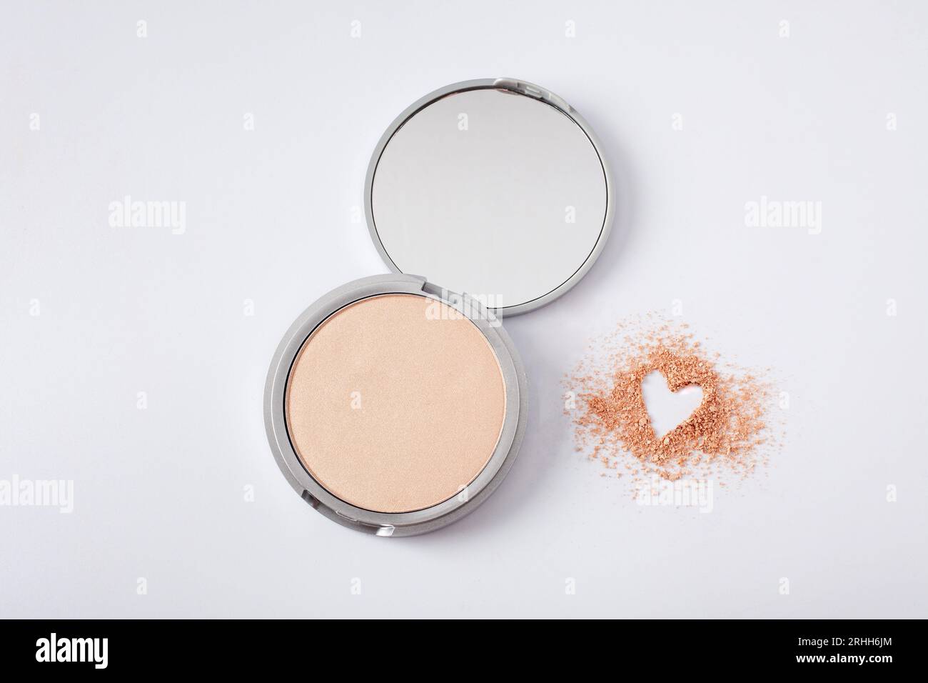 Beautiful eyeshadow palette on white with crushed sample heart shape ...