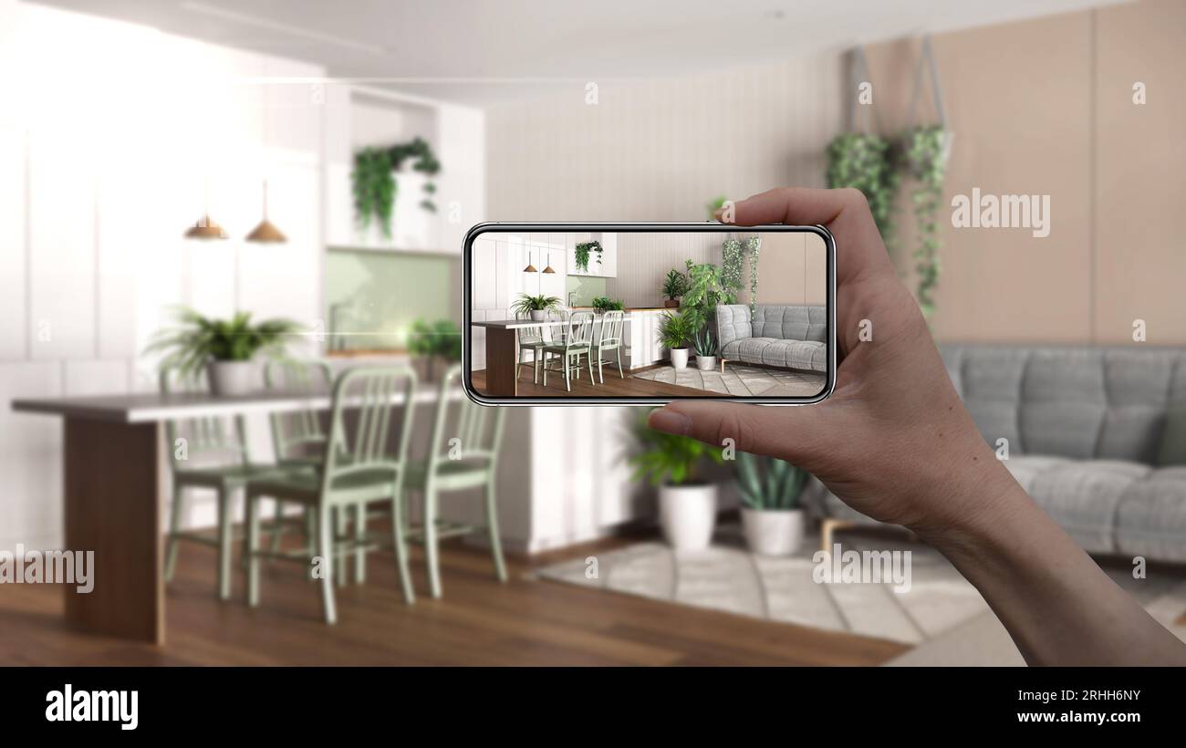 Hand holding smart phone, AR application, simulate furniture and ...