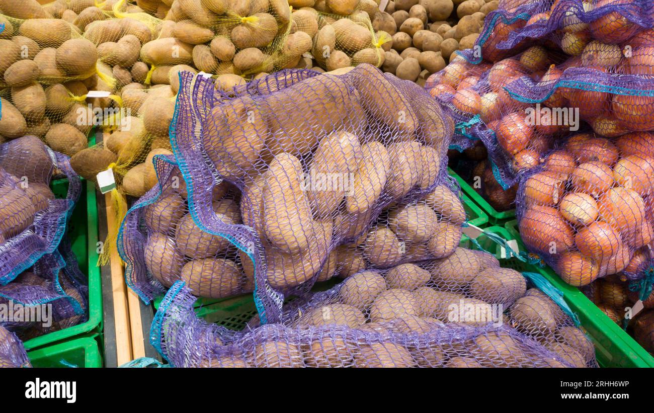 Raw potato packed and placed on showcase of market. Agriculture ...