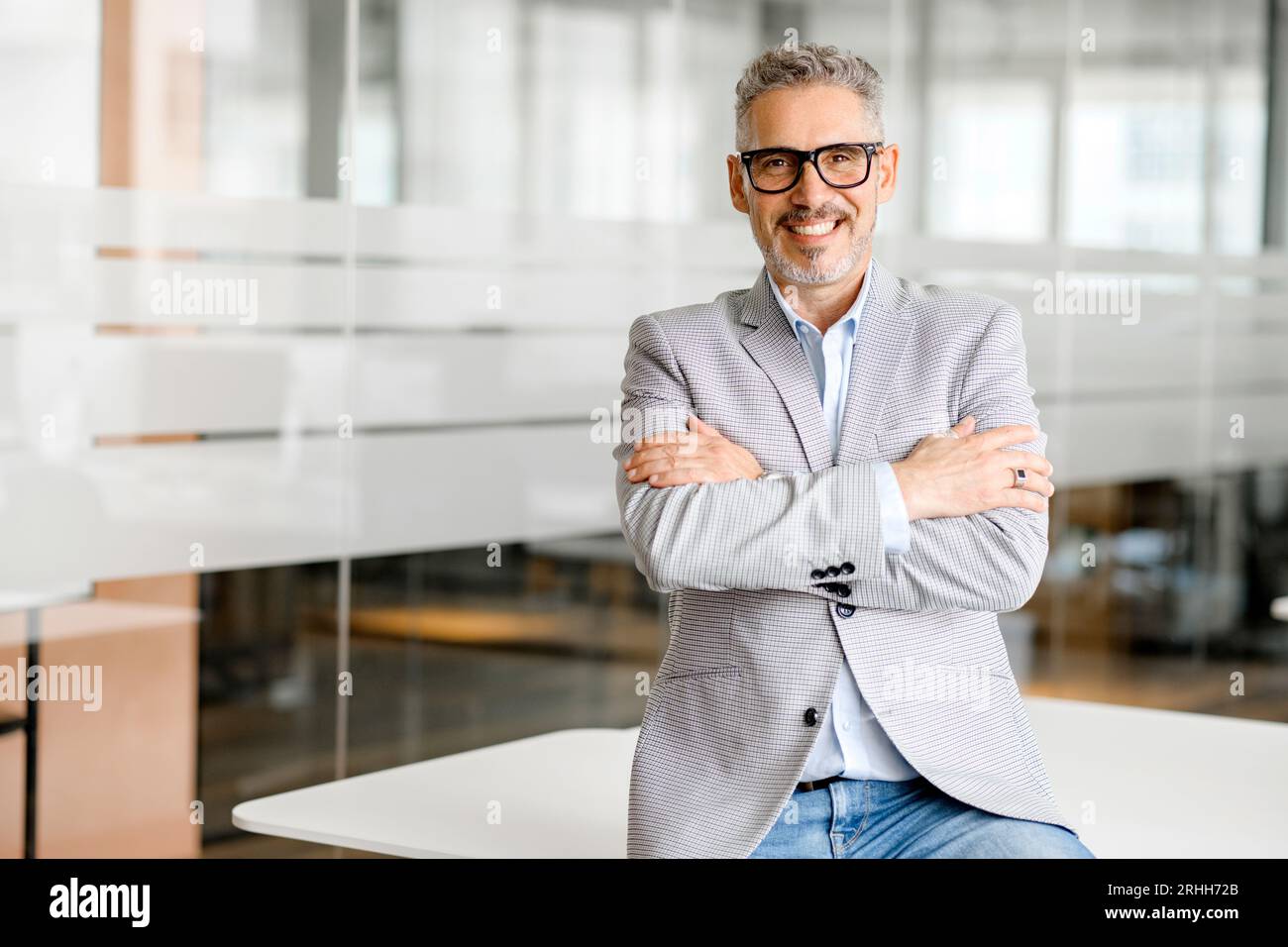 Cheerful mature 50s businessman, startup owner, investor standing with ...