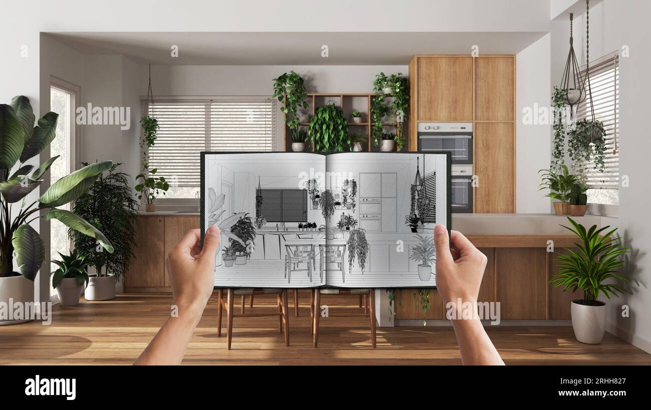 Hands holding notepad with kitchen design blueprint sketch or drawing ...