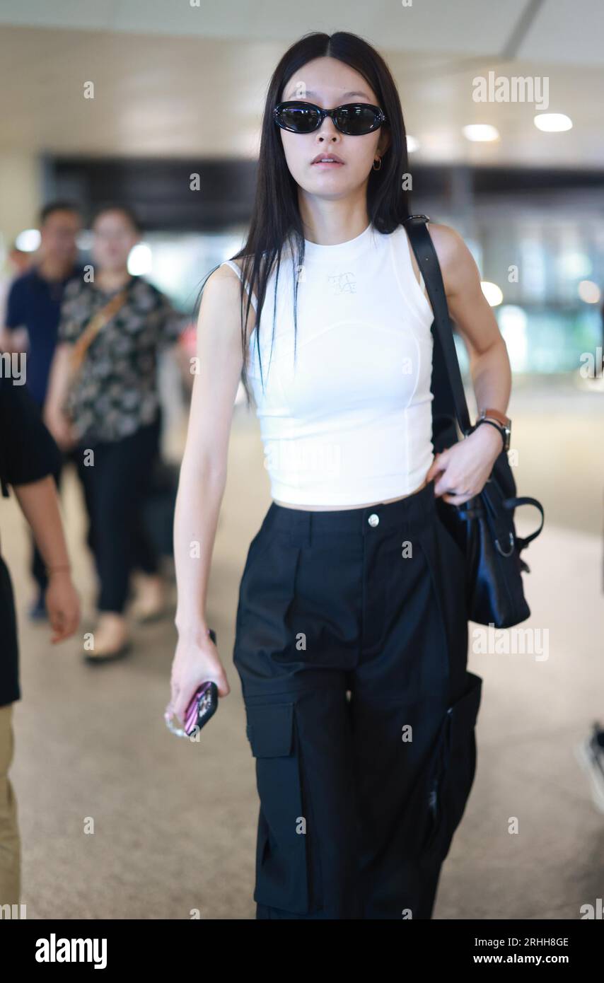 Hong Kong actress and fashion model Janice Man appears at the airport ...