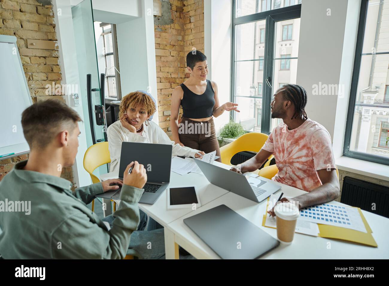brainstorming, multicultural team using gadgets and sharing ideas, startup, office workers, gen ...
