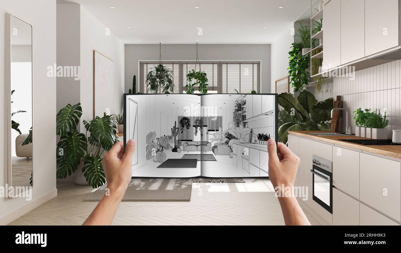 Hands holding notepad with living room design blueprint sketch or ...