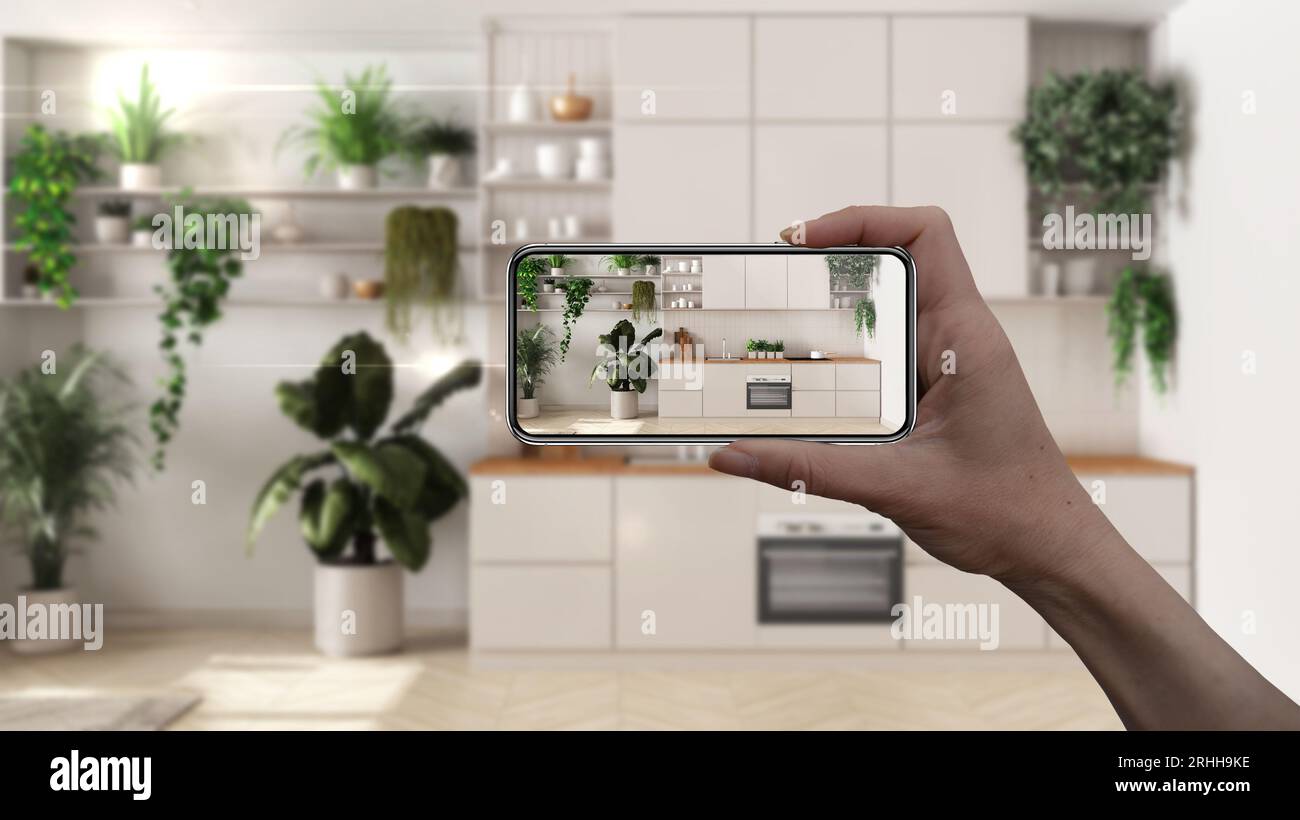 Hand holding smart phone, AR application, simulate furniture and ...