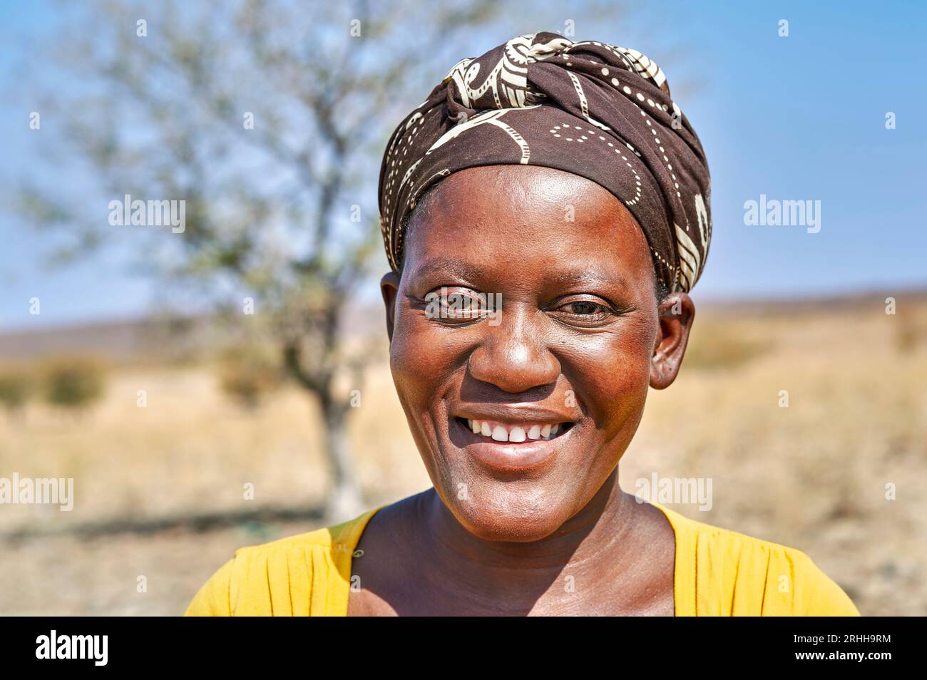 Namibia. Portrait of a young smiling woman of Zemba Bantu ethnic group ...