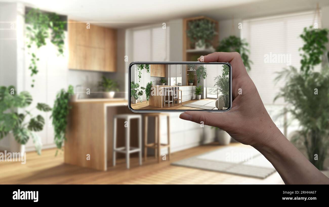 Hand holding smart phone, AR application, simulate furniture and ...