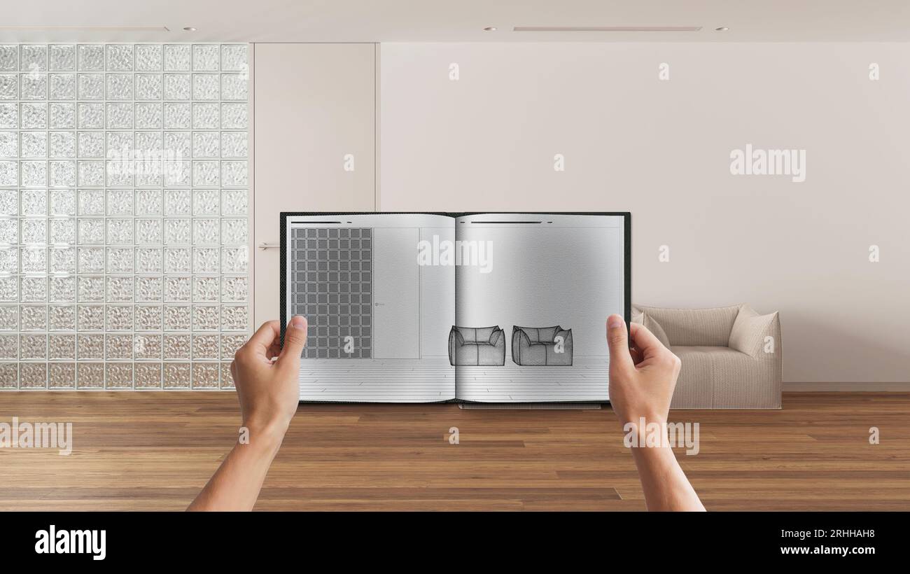 Hands holding notepad with minimal office design blueprint sketch or ...