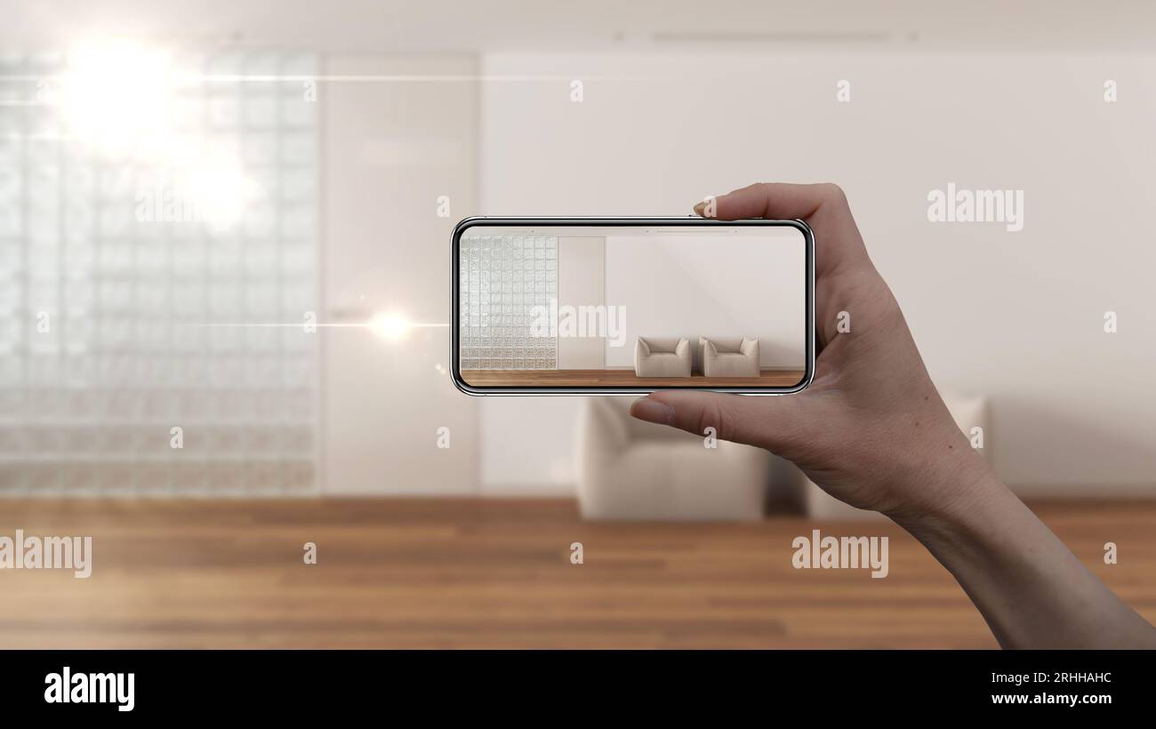 Hand holding smart phone, AR application, simulate furniture and ...
