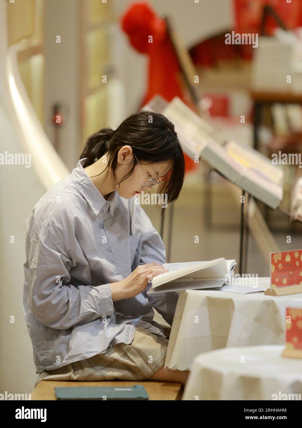 Children read books at Zhongshuge bookstore during summer vacation in Yangzhou City, east China ...
