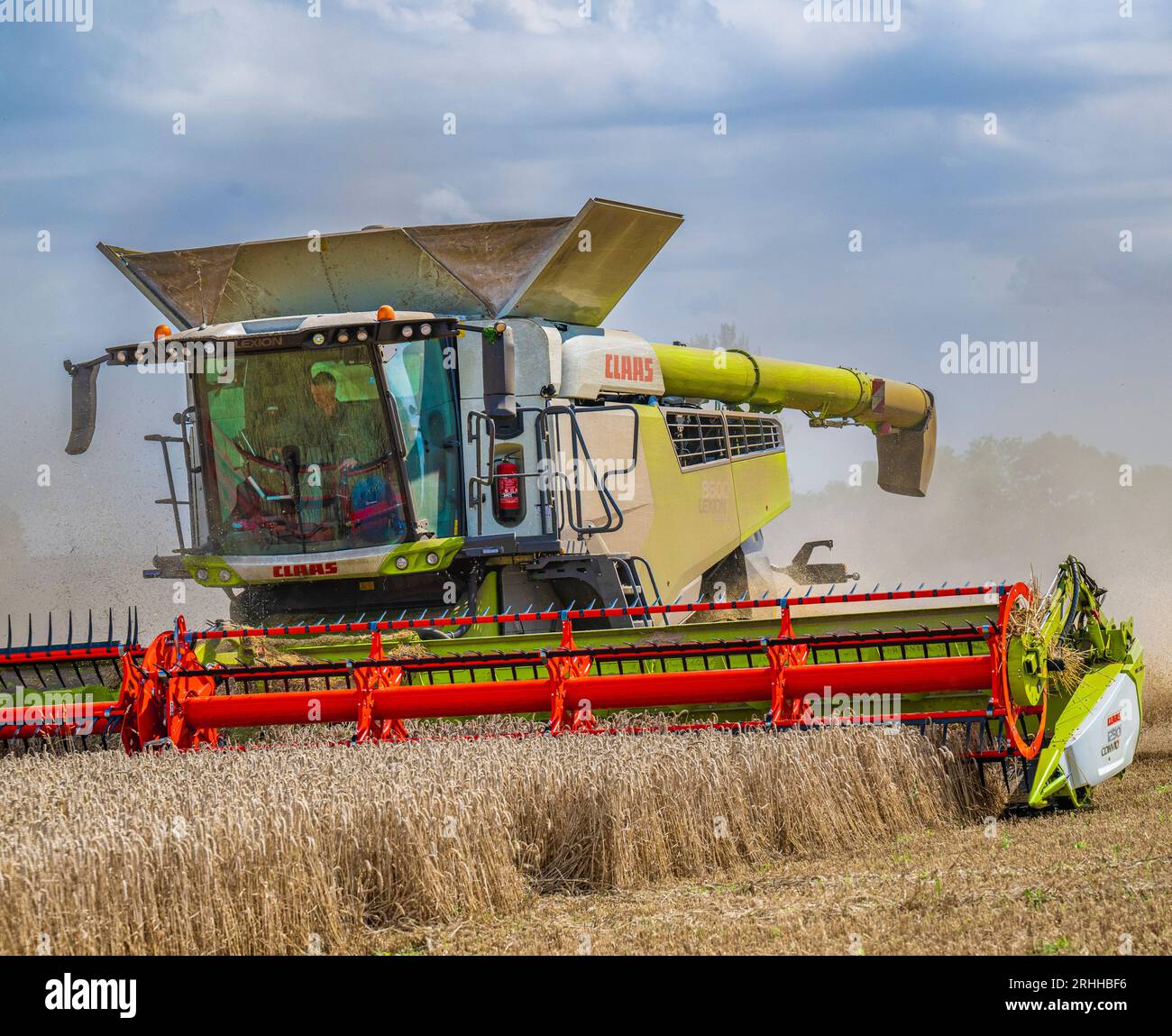 A Claas combine harvester working to harvest the corn on a summer’s day ...