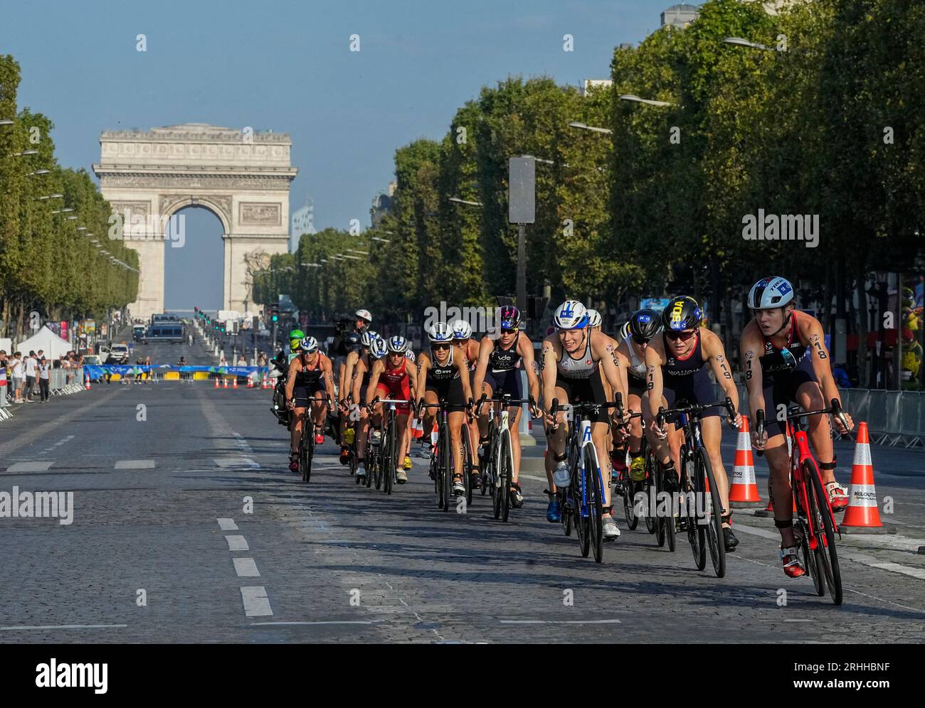 Riders on the first bike leg compete on the Champs Elysee avenue of the ...