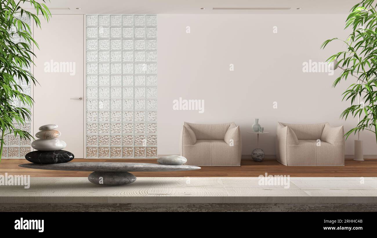 Wooden vintage table or shelf with stone balance and bamboo plants ...