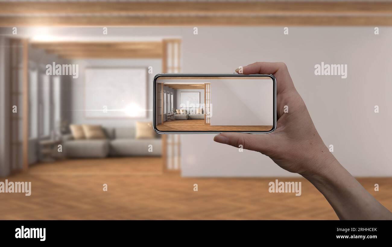 Hand holding smart phone, AR application, simulate furniture and ...