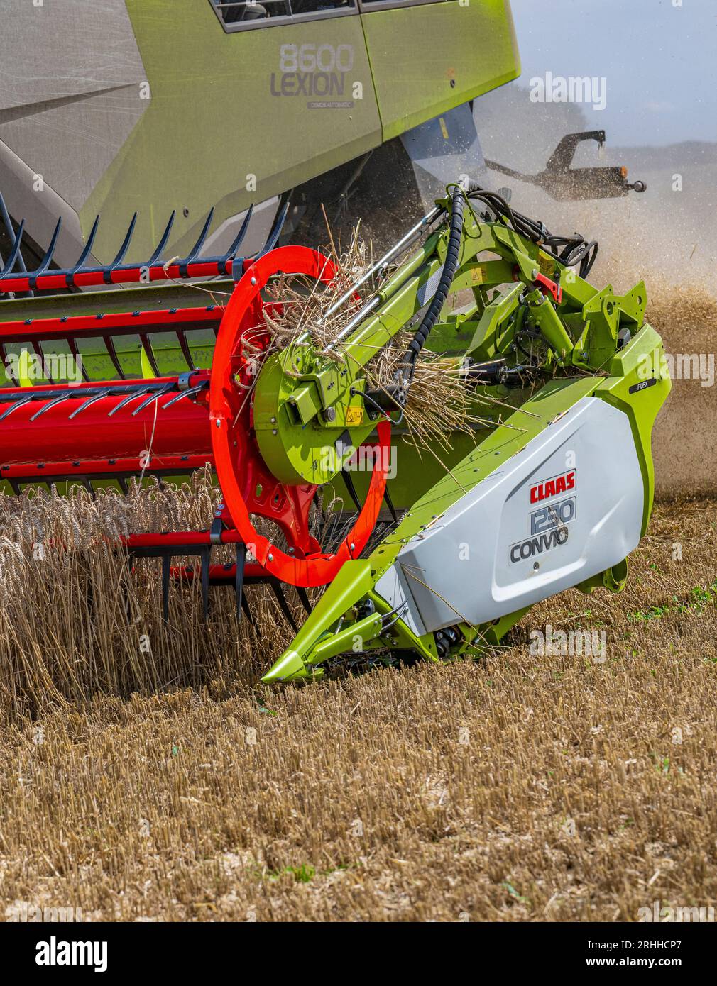 A Claas combine harvester working to harvest the corn on a summer’s day ...
