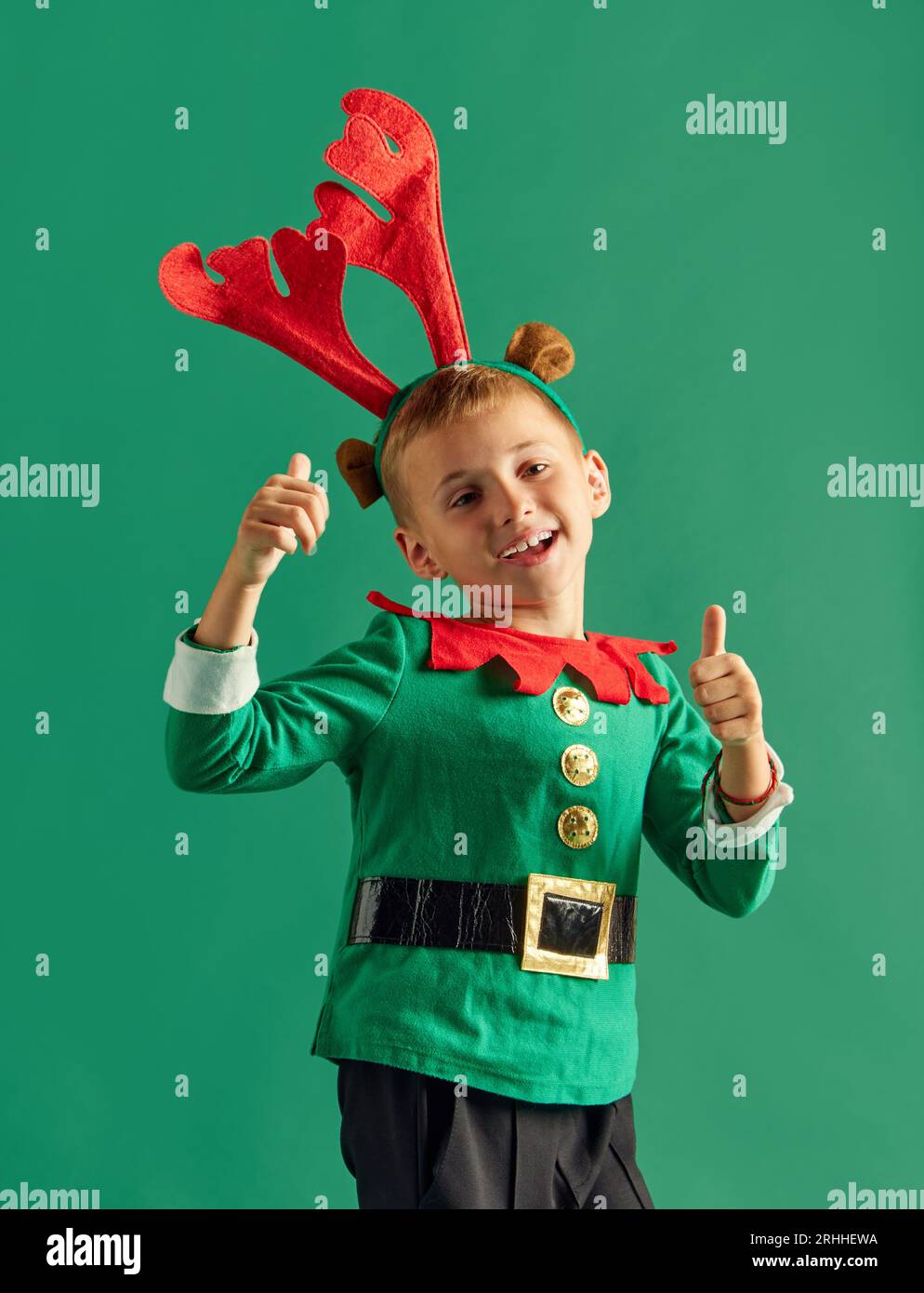 Portrait fo little boy, happy child in costume of elf cheerfully posing ...