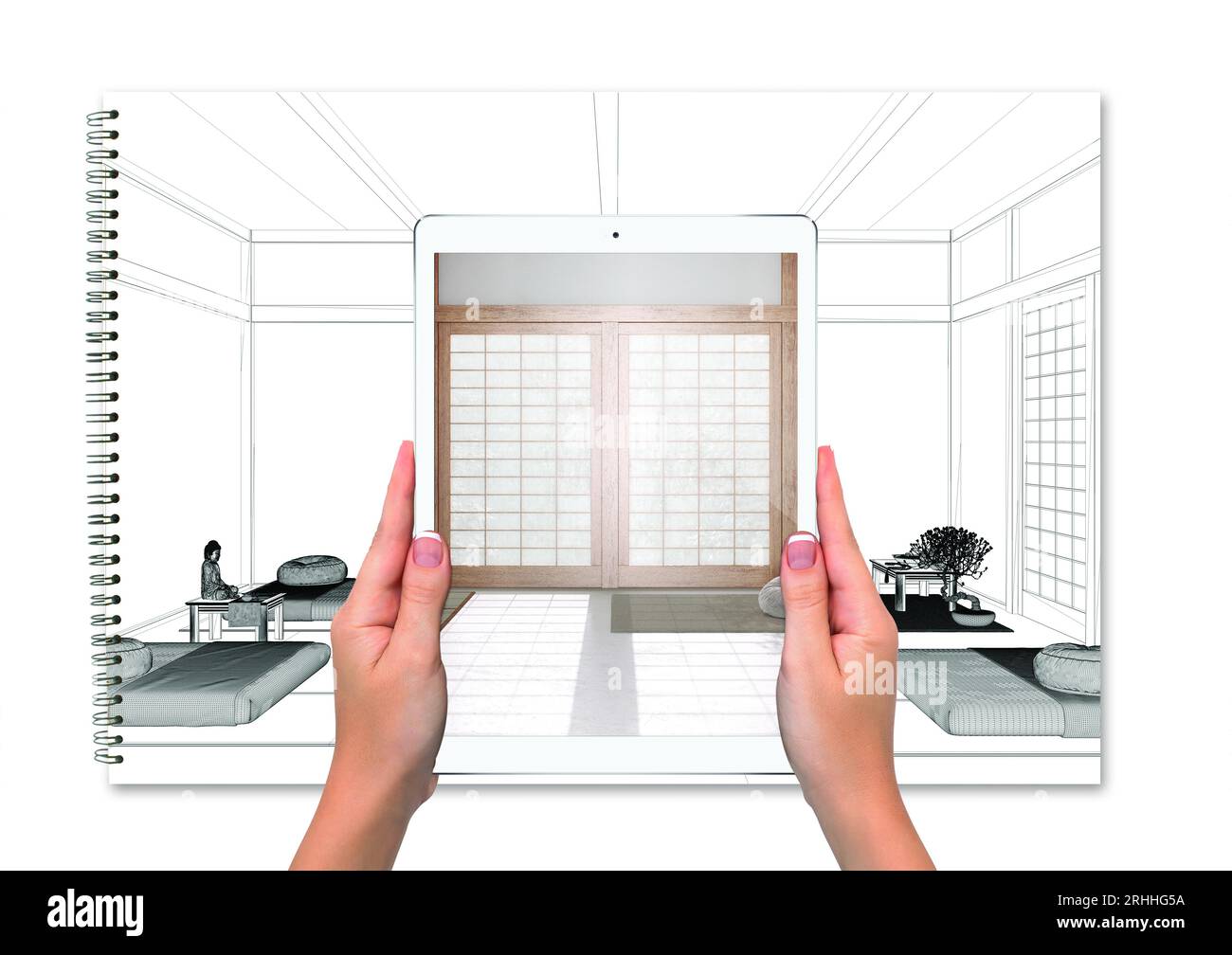 Hands holding tablet showing meditation room, notebook with blueprint ...