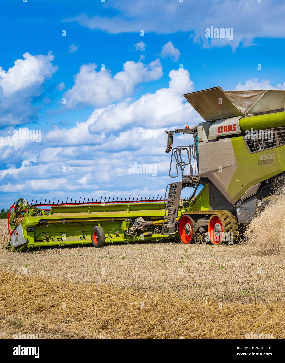 A Claas combine harvester working to harvest the corn on a summer’s day ...