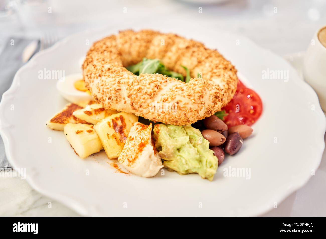Turkish breakfast with simit, cheese, tomato, cucumber, olives ...