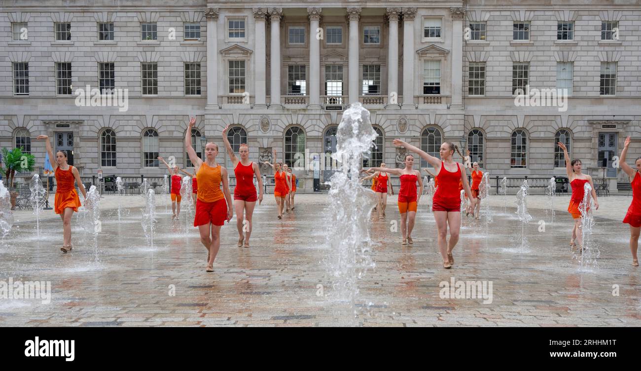 Somerset House, London, UK. 17 August 2023. 22 all-female dancers in vivid orange costumes ...