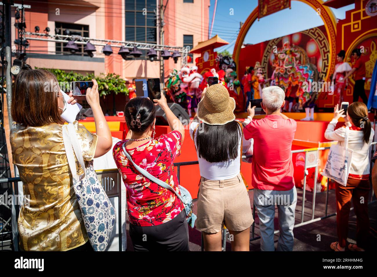 Thai people and tourists busily photograph the dance and singing show ...