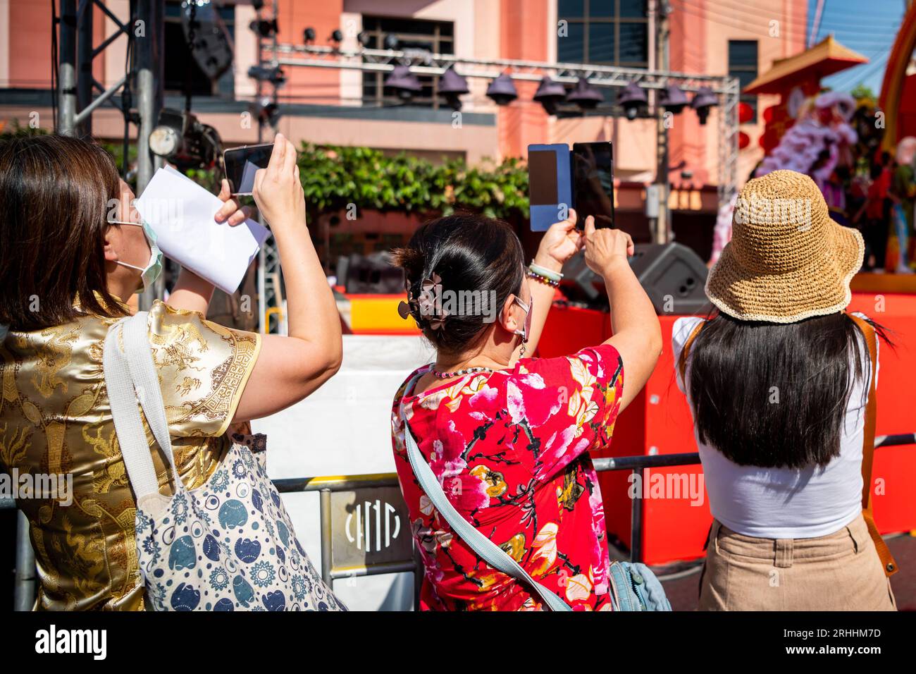Thai people and tourists busily photograph the dance and singing show ...