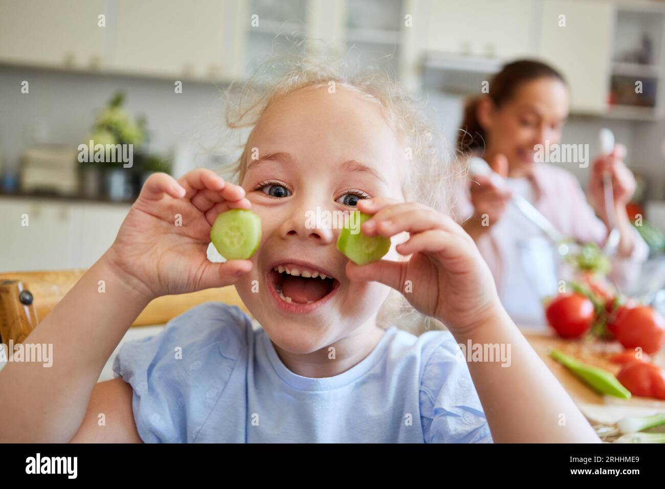 Playful daughter playing vegetable hi-res stock photography and images ...