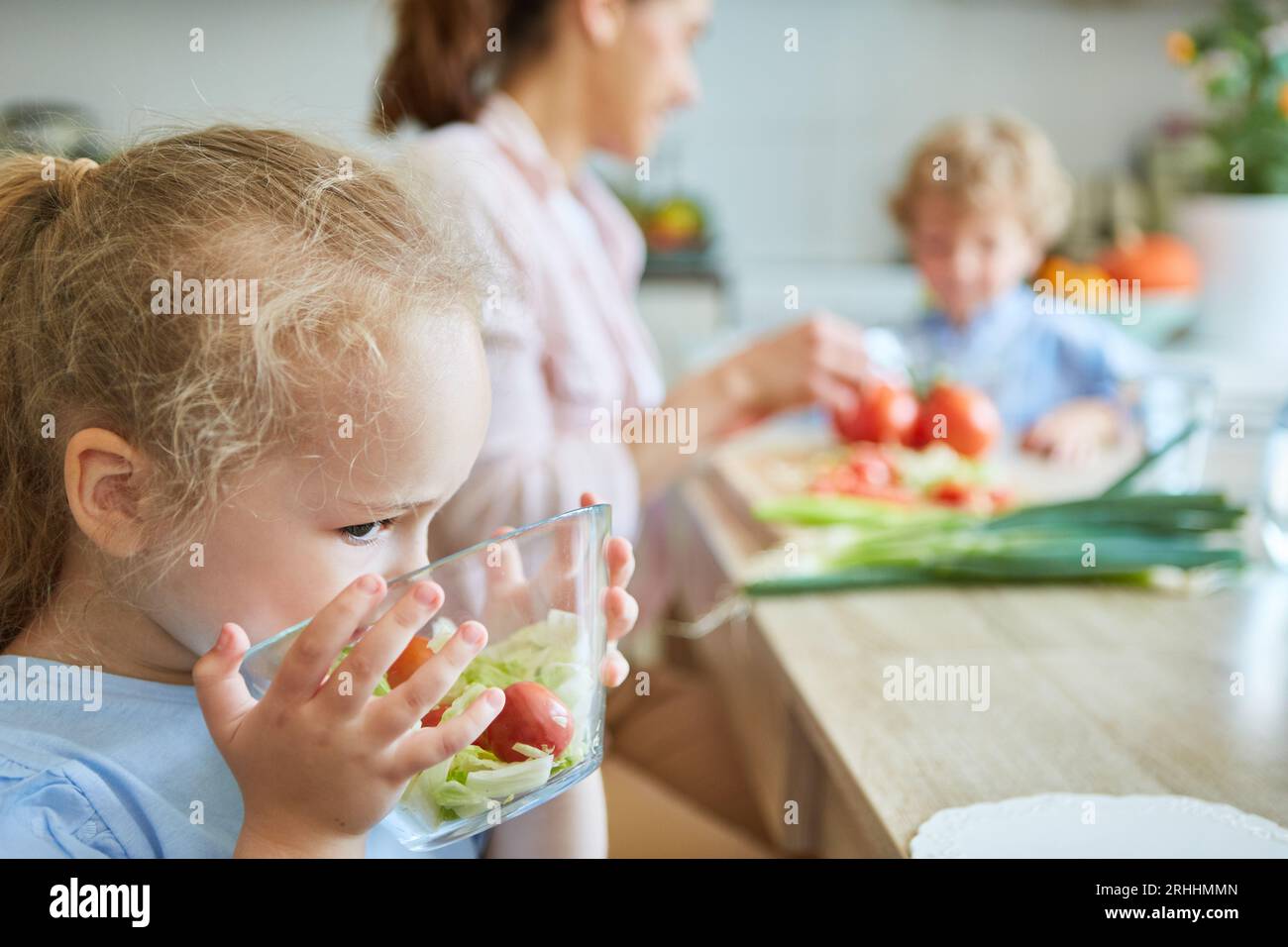 Woman children preparing vegetables hi-res stock photography and images ...