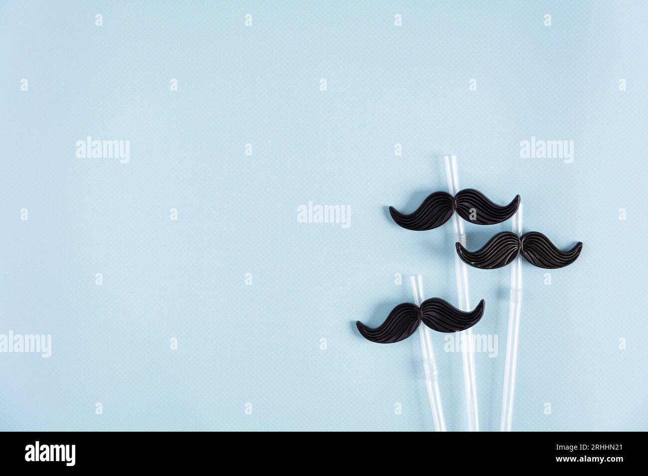 Curly mustaches on colorful background. Fake mustache. Top view Stock ...
