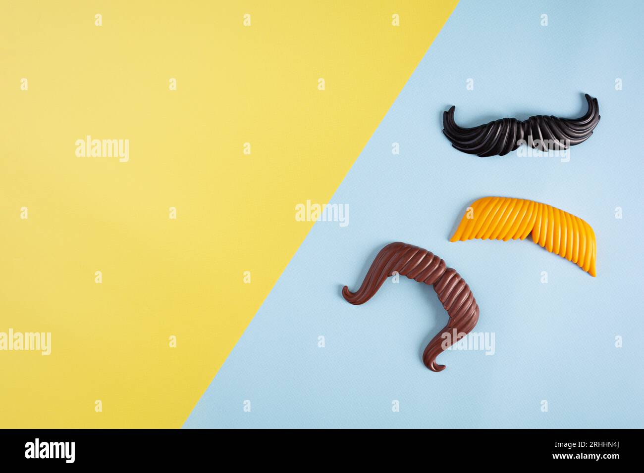 Curly mustaches on colorful background. Fake mustache. Top view Stock ...