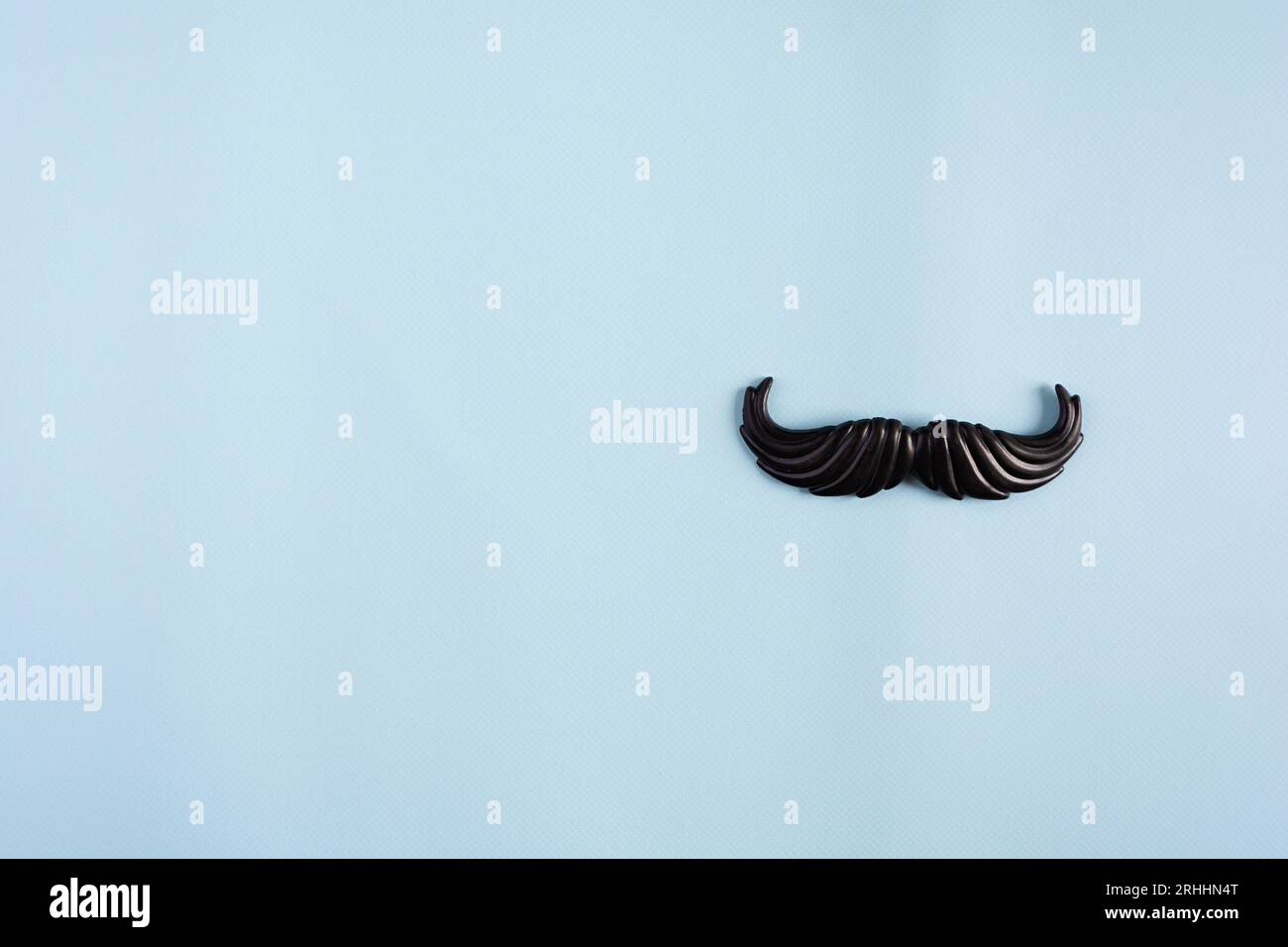 Curly mustaches on colorful background. Fake mustache. Top view Stock ...
