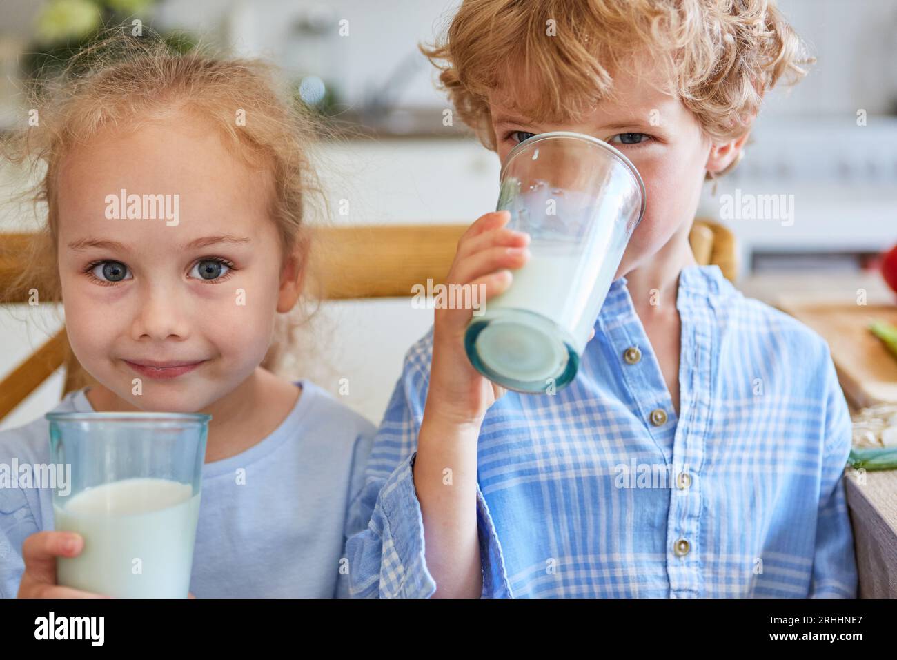 Boy and girl drinking milk hi-res stock photography and images - Alamy