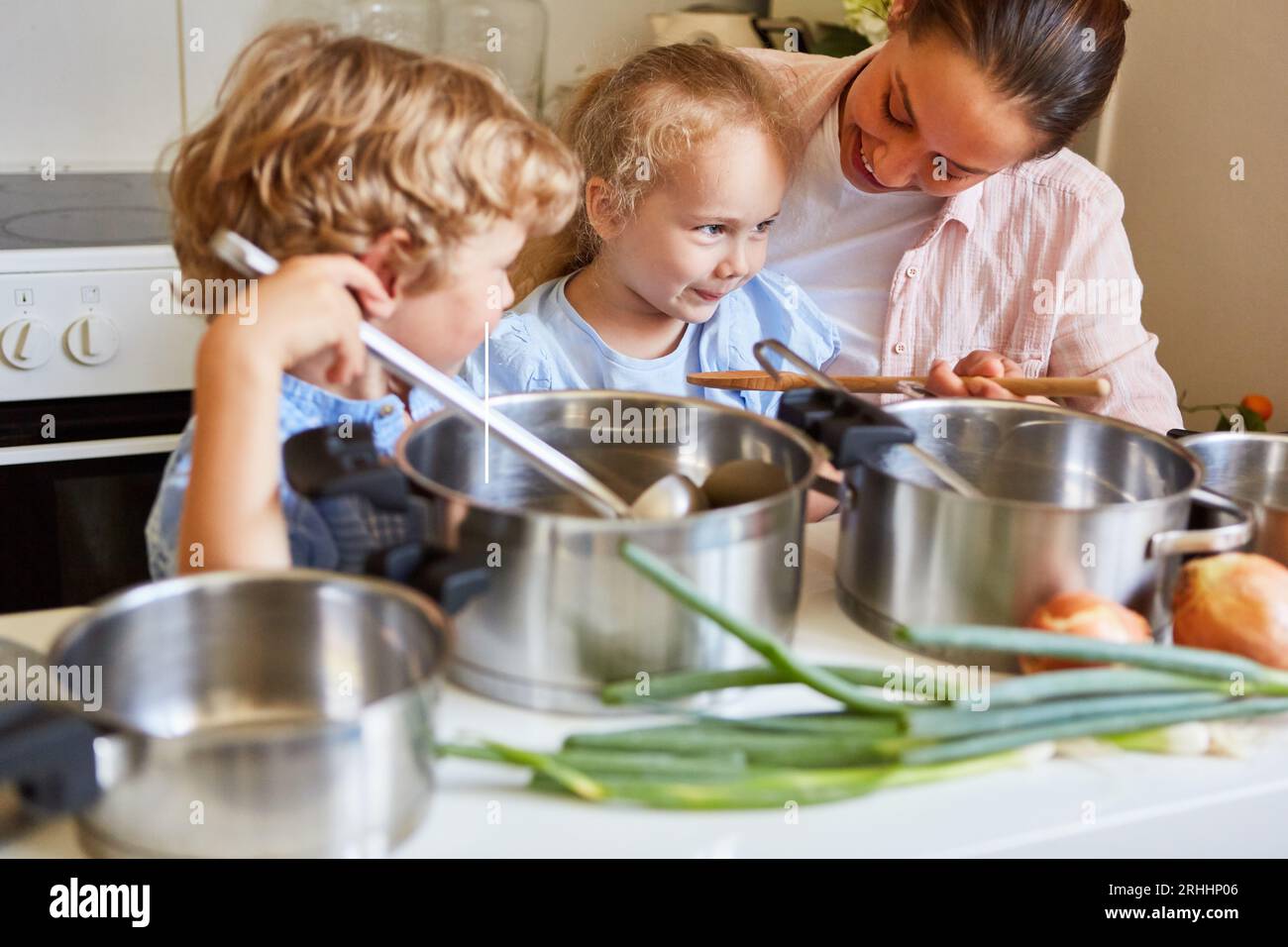 Children tasting soup hi-res stock photography and images - Alamy
