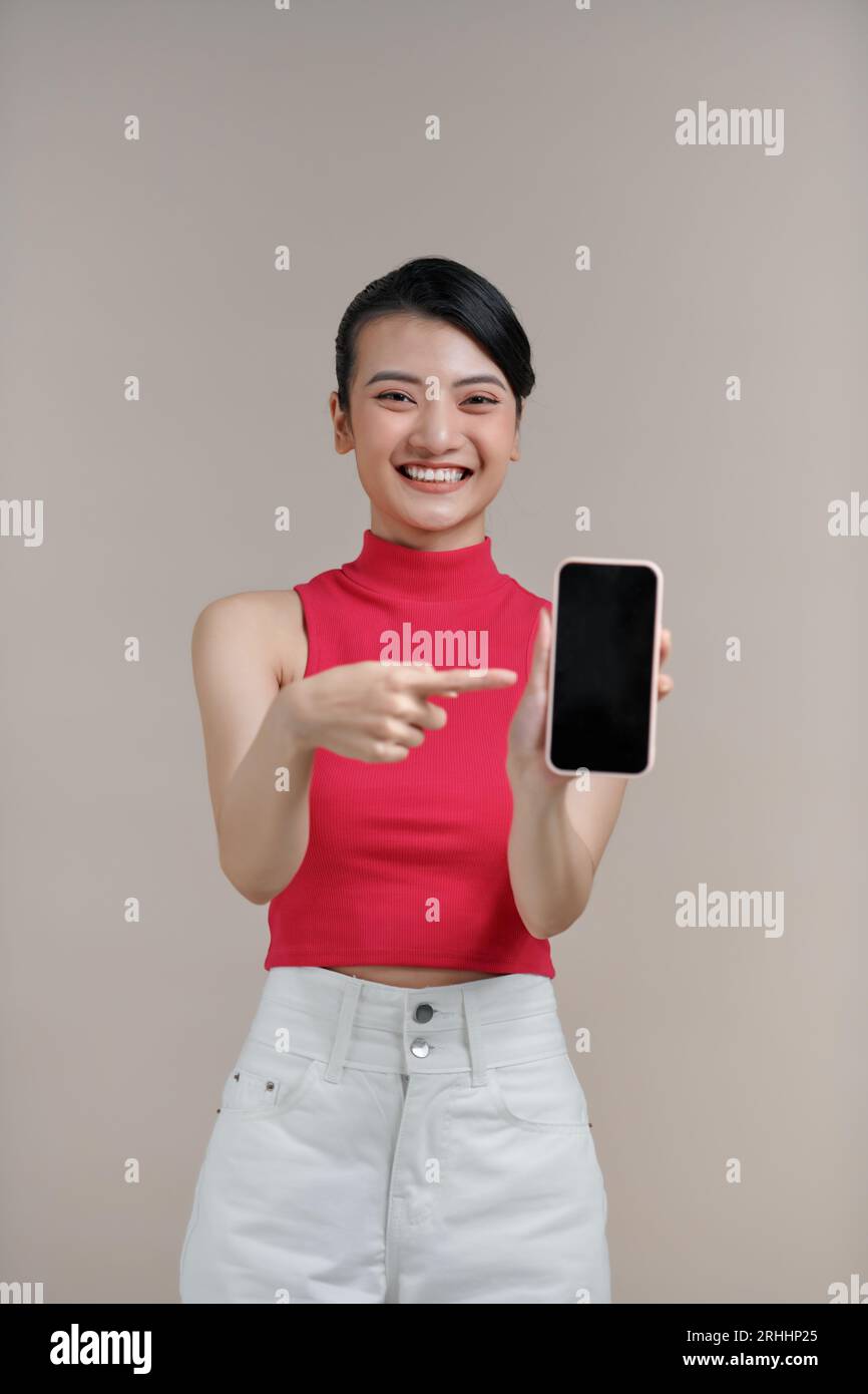 The beautiful Asian woman pointed at the phone with her finger Stock ...