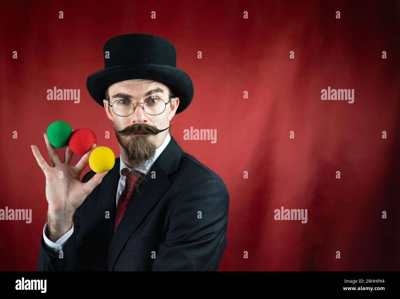 Vintage Caucasian Magician with top hat, glasses and mustache with ...